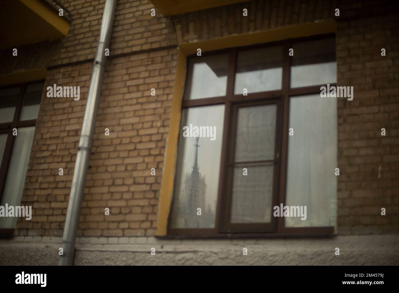 Large window in old house. High window. Details of wall of brick house ...
