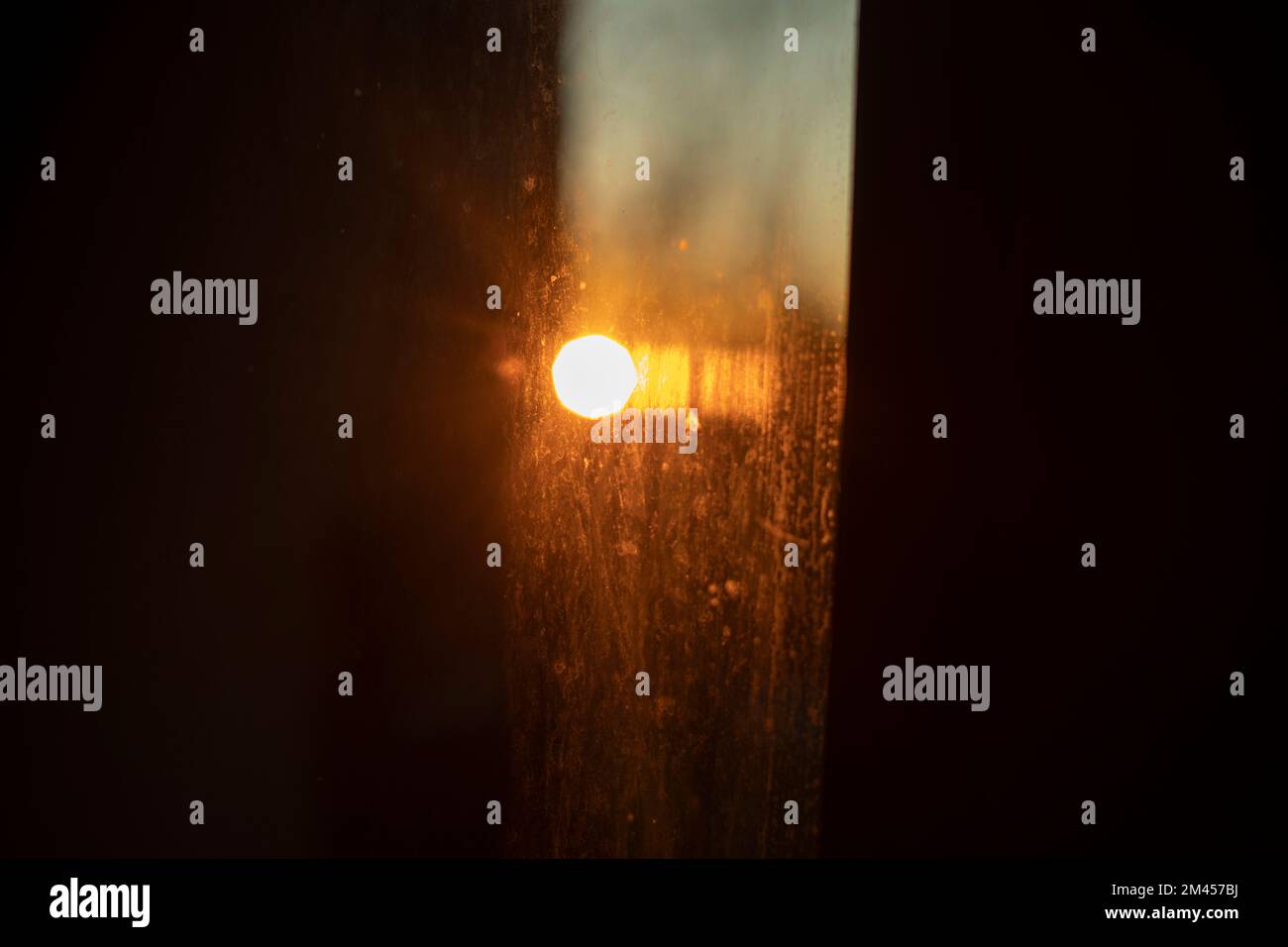 Dawn outside window. Bright sun in morning. Orange color from first ...