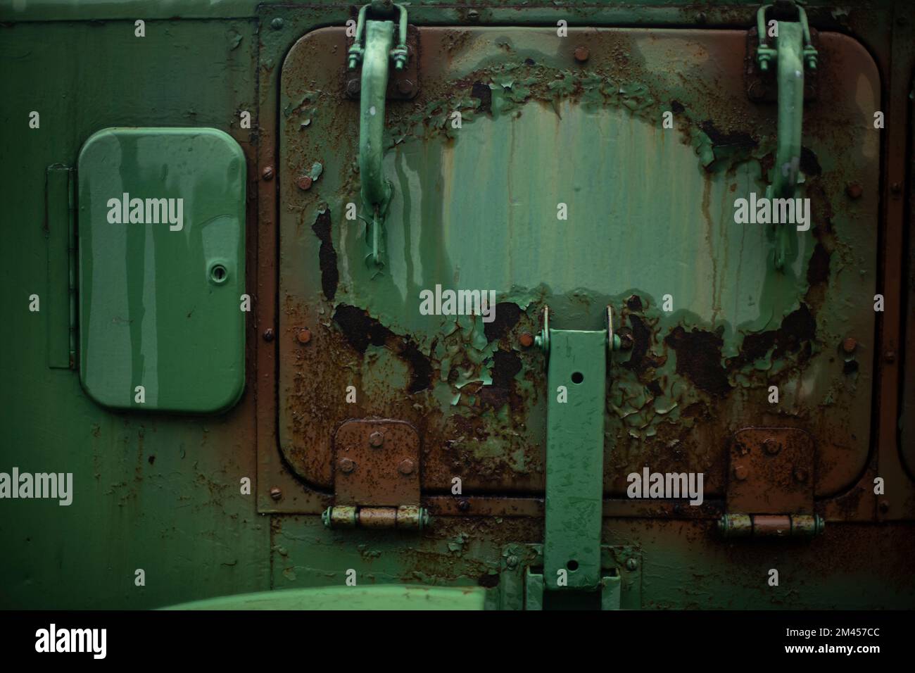 Rust on metal. Field kitchen door. Rust on green paint. Old machine in ...