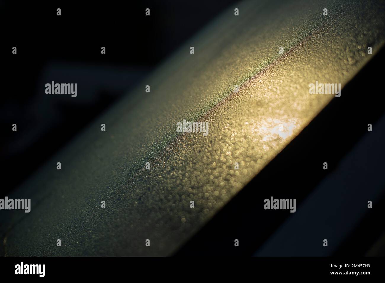 Glass condensate. Water drops on glass. Car in detail. Light on back ...