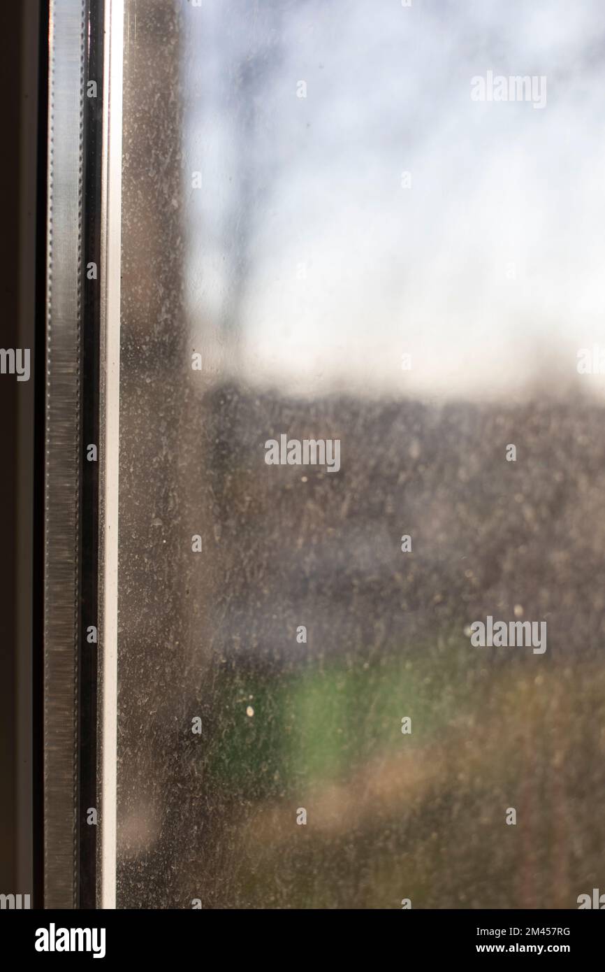 Dust on glass. Dirty window in morning. Surface in fine sand. Window ...