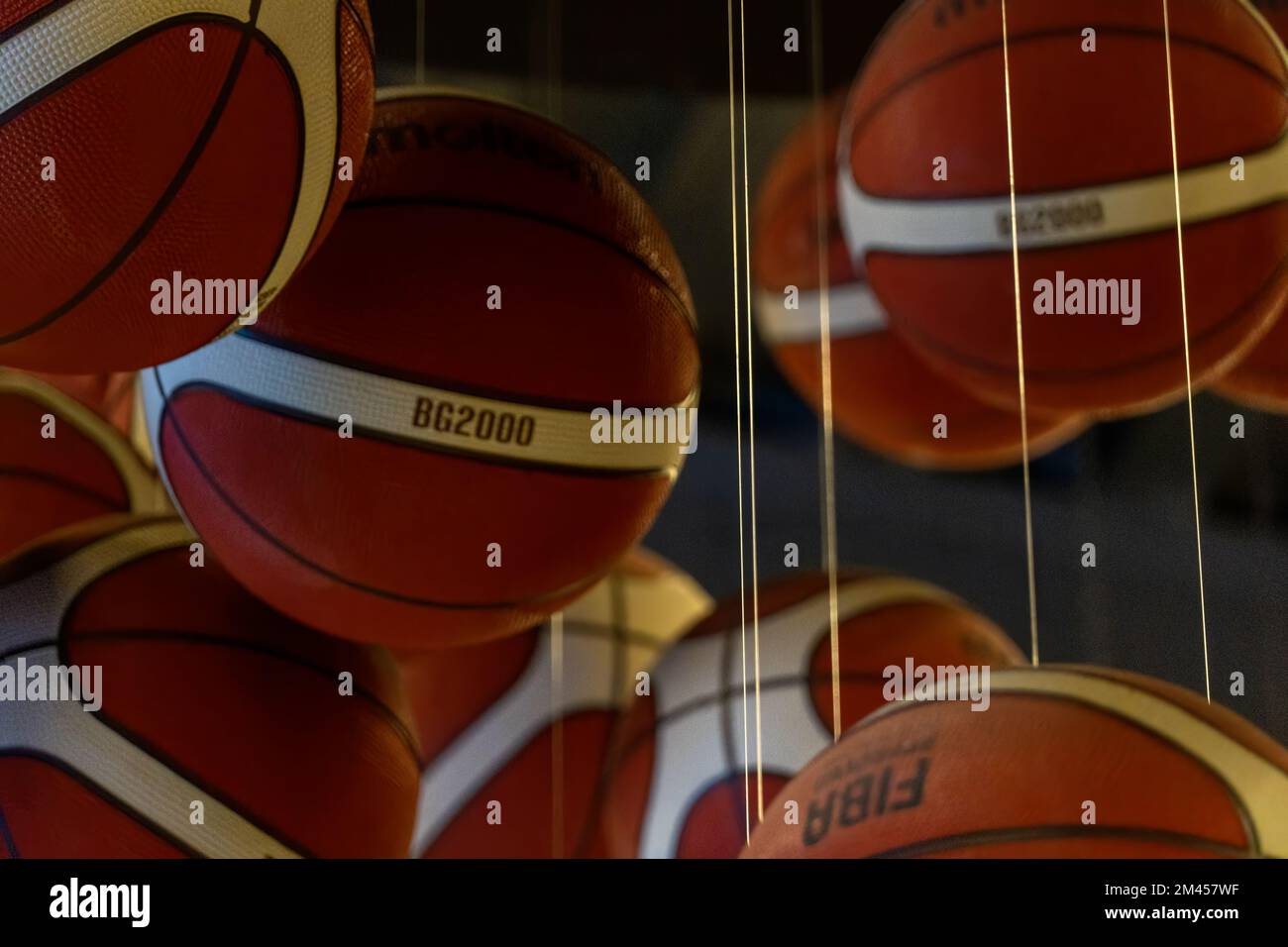 several basketballs hung with strings mexico balls Stock Photo - Alamy