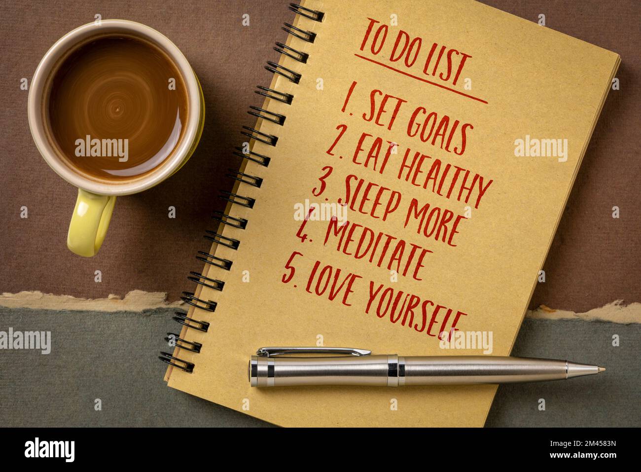 inspirational to do list in a notebook - set goals, eat healthy, sleep ...