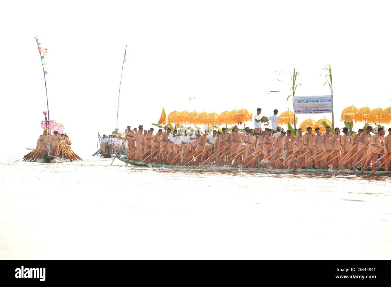 Peoples paddle by legs on the procession in Phaung Daw Oo Festival ...