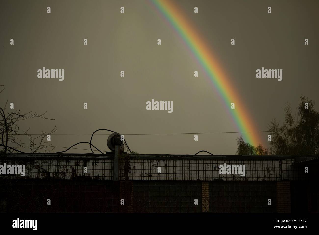 Rainbow in sky. Beautiful weather. Decomposition of light into colors ...