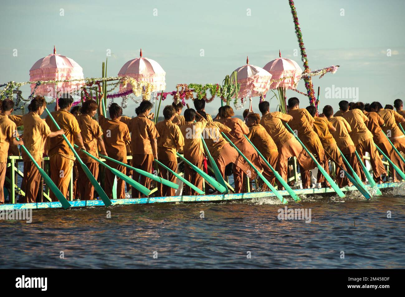 Peoples paddle by legs on the procession in Phaung Daw Oo Festival ...