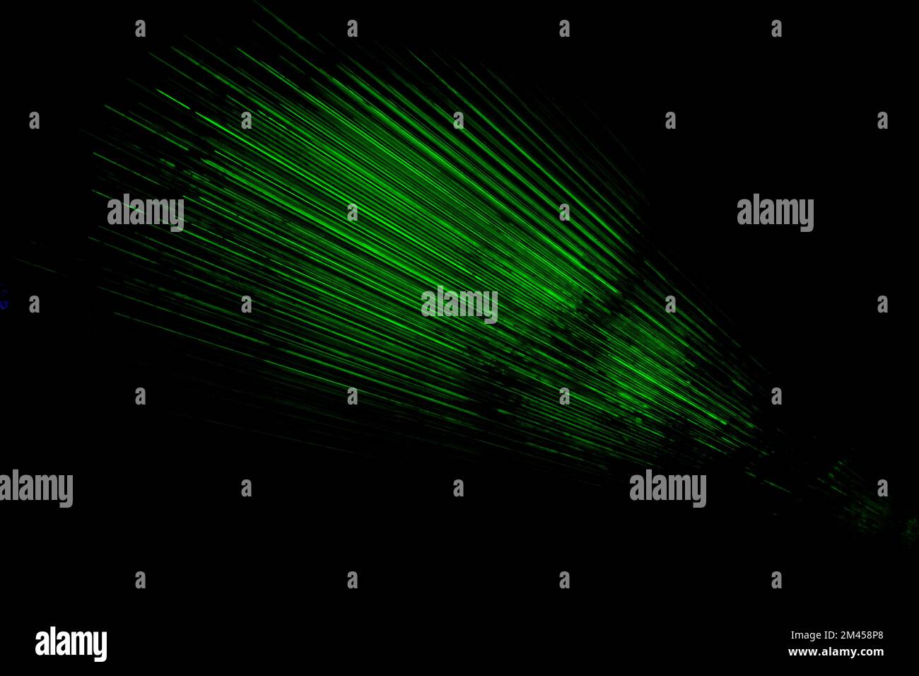 Laser in dark. Green rays on black background. Laser radiation in space ...