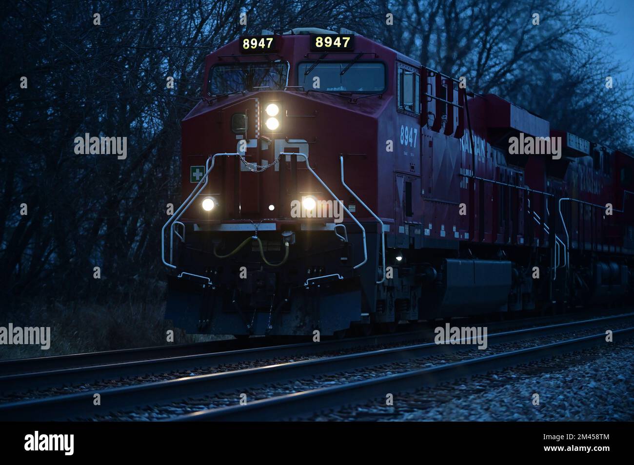 Bartlett, Illinois, USA. Canadian Pacific Railway locomotives power a freight train through the ...