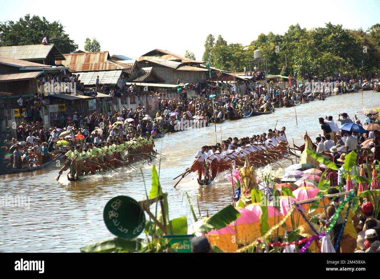 Peoples paddle by legs on the procession in Phaung Daw Oo Festival ...