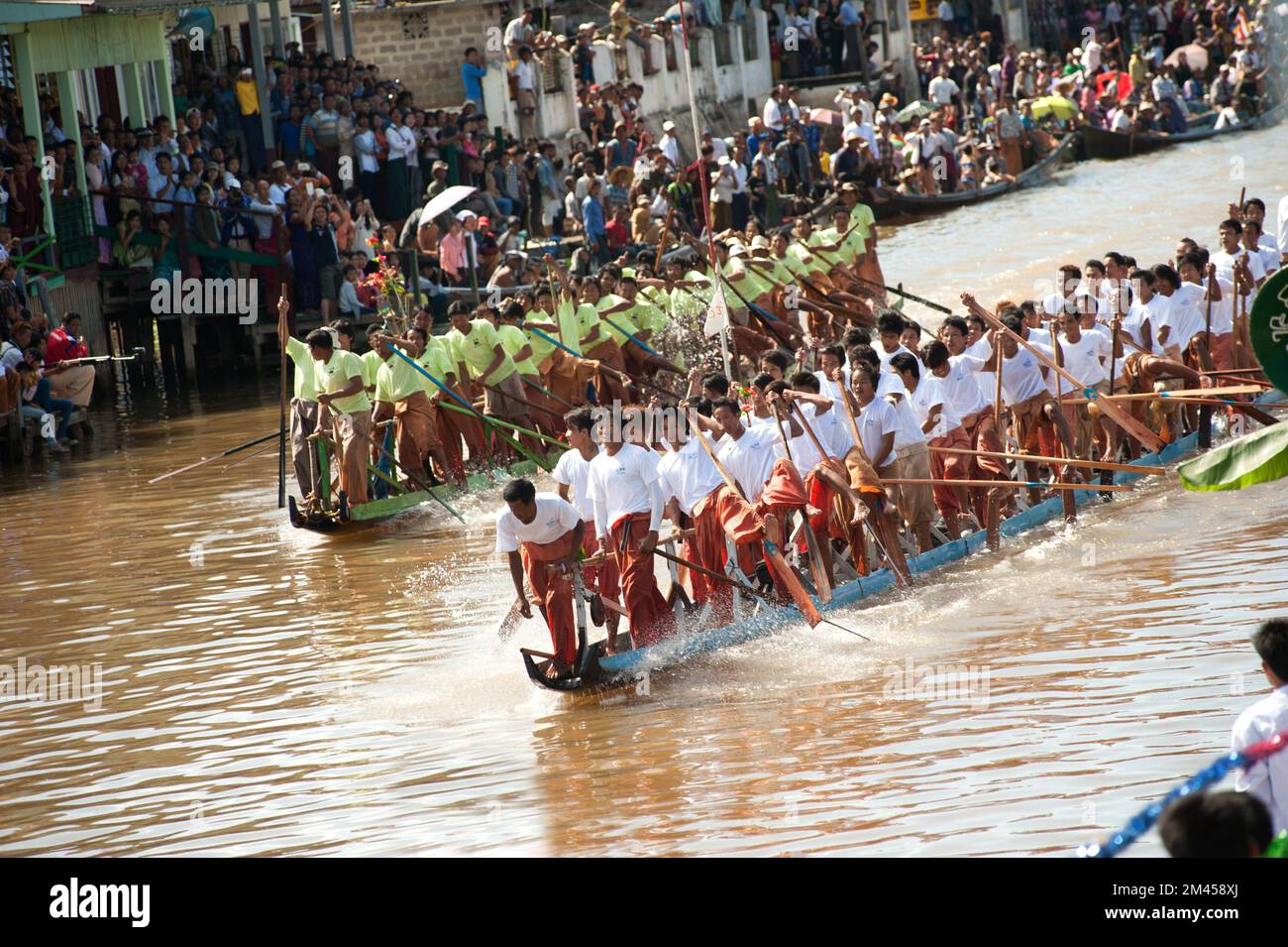 Peoples paddle by legs on the procession in Phaung Daw Oo Festival ...