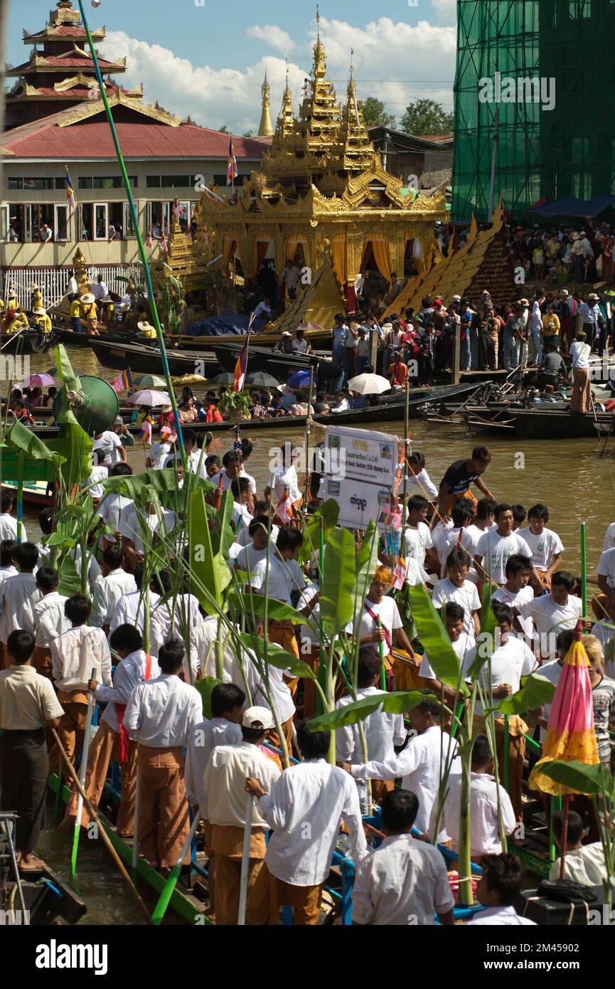 Peoples paddle by legs on the procession in Phaung Daw Oo Festival ...