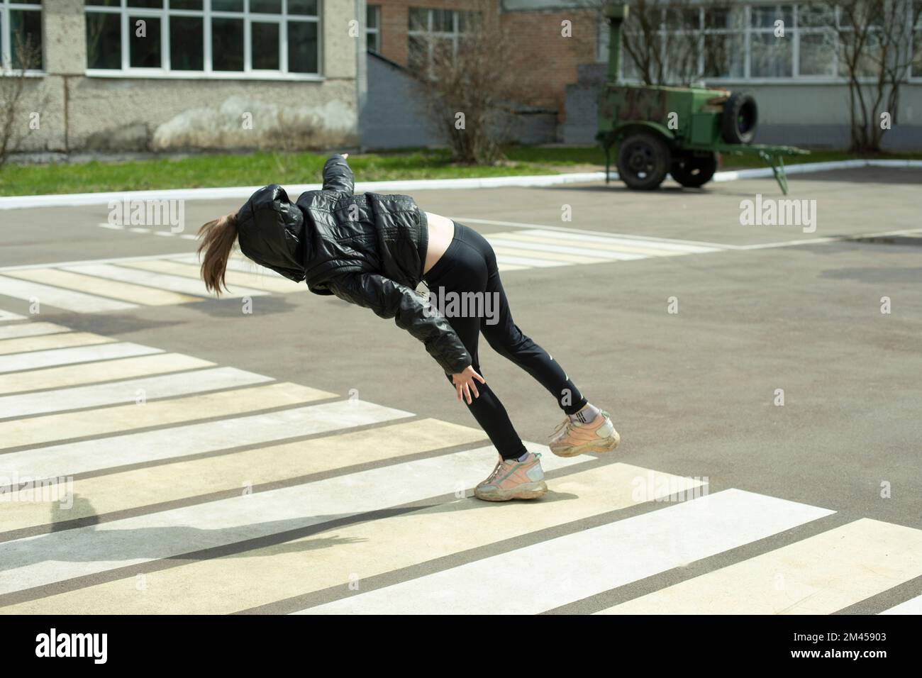 Child falls on asphalt. Beginning of fall. Girl stumbled Stock Photo ...