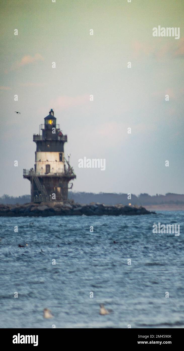 A view of Orient Point Lighthouse across the water, USA Stock Photo - Alamy
