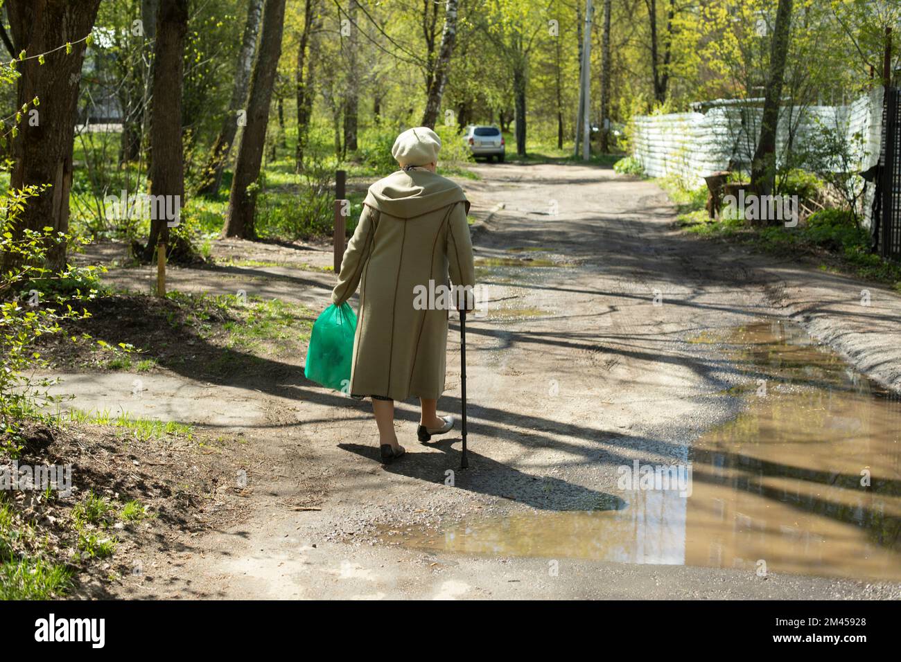 Pensioner Walks Down Street Grandmother In Russia Woman With Walking