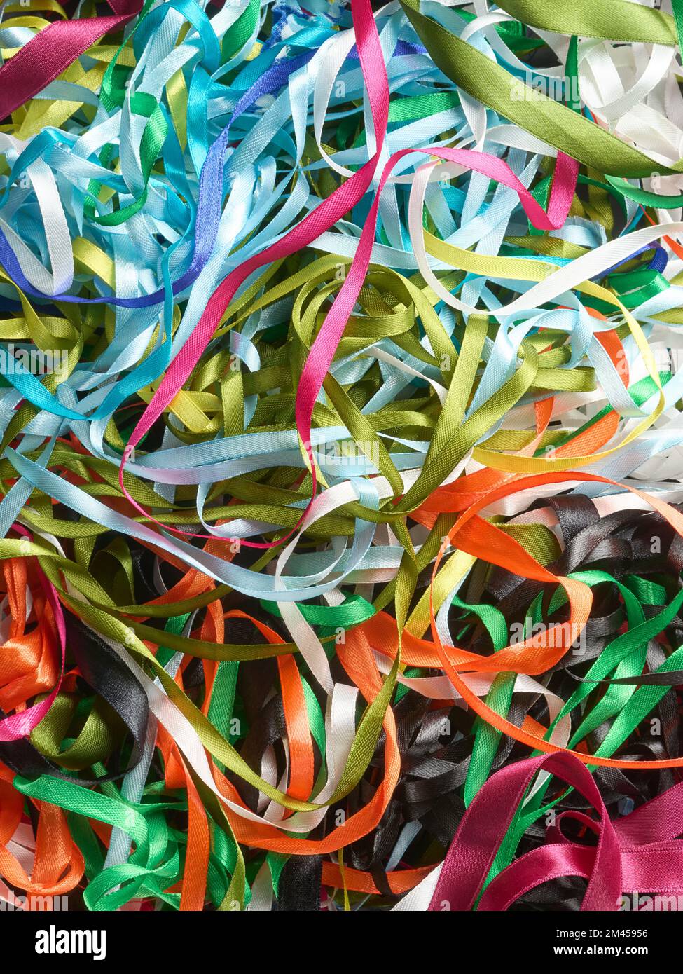 bunch of tangled colorful textile satin ribbons, full frame background ...