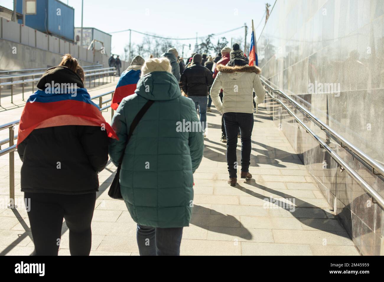 People walk around city in spring. Citizens on street. Lot of people ...
