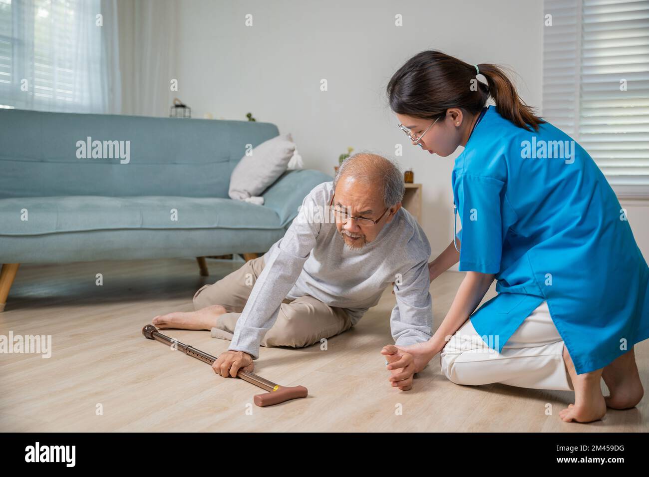 Disabled elderly old man patient with walking stick fall on floor and ...
