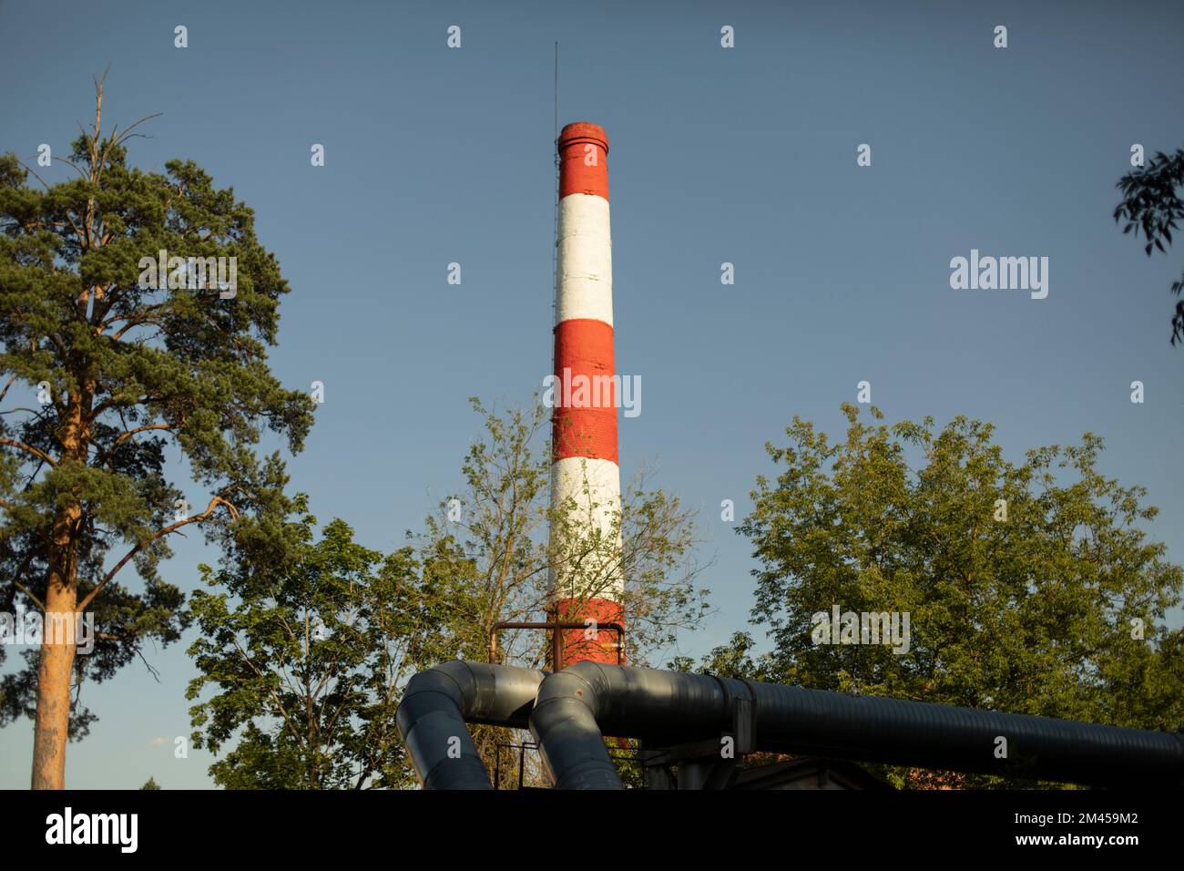 Red industrial pipe. Pipe factory. Details of industrial facility ...