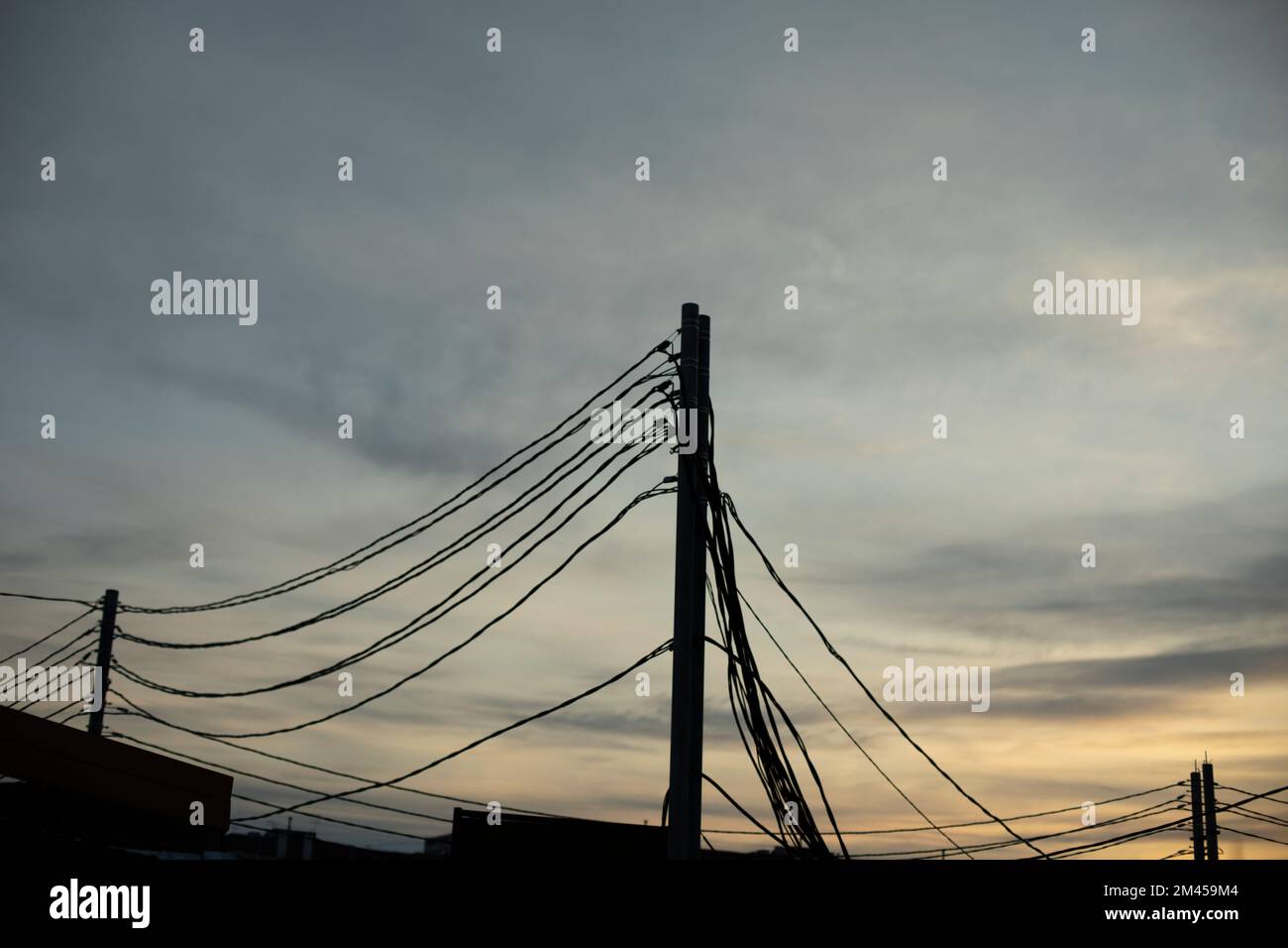 Electrical wires on pole. Many wires against sky. High voltage pole ...