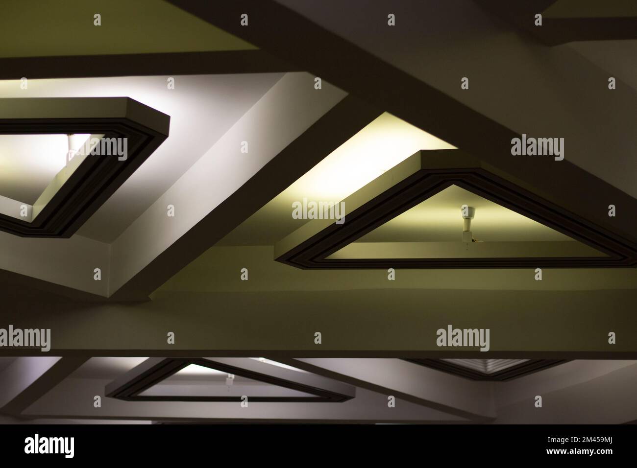Interior light. Lamp is triangular. Ceiling details Stock Photo - Alamy