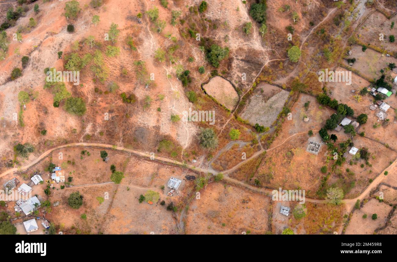 View of a village in a rural area amidst the mountains and river, seen ...