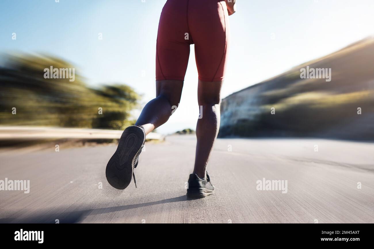 Motion blur, woman and legs running on road for exercise, marathon ...
