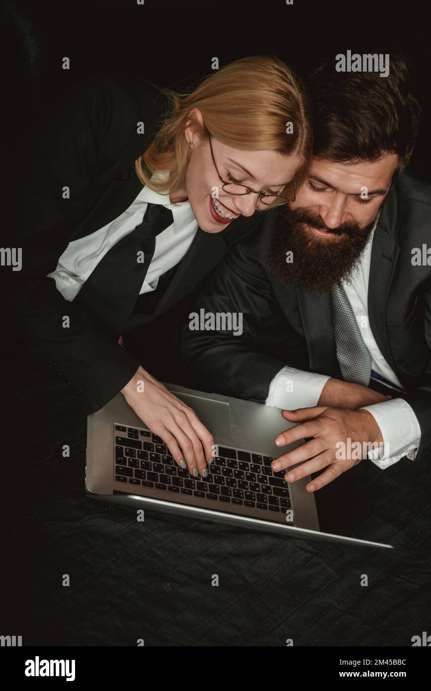 Business people meeting deadline. Young happy positive couple ...
