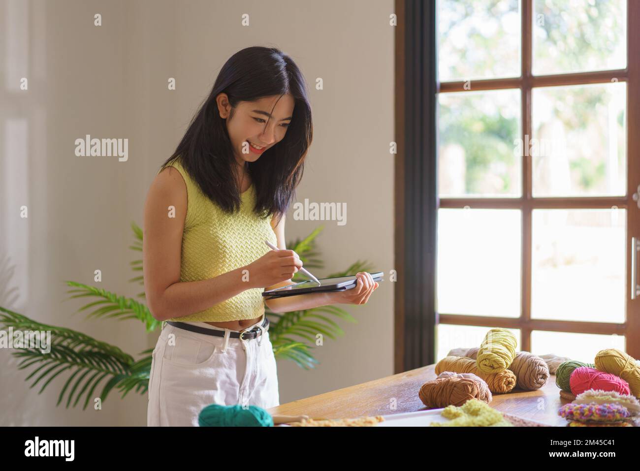 Needlework concept, Women sketches to designing pattern for handicraft ...