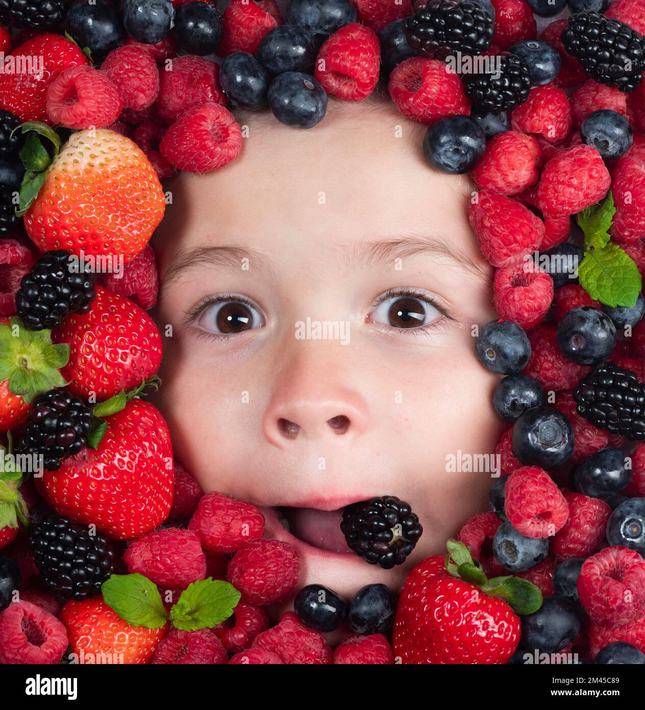 Healthy food for kids. Assorted mix of strawberry, blueberry, raspberry ...