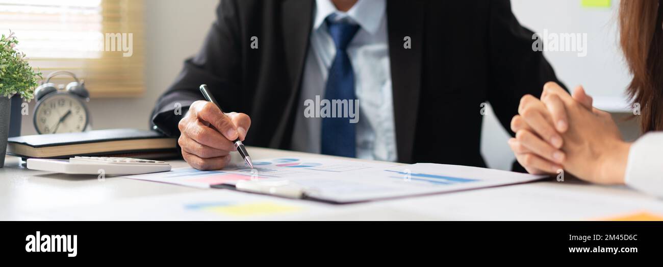 Business partnership concept, Senior in business point on document to ...
