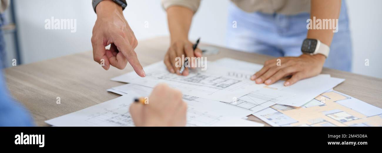 Engineering construction concept, Engineers team point blueprint of ...