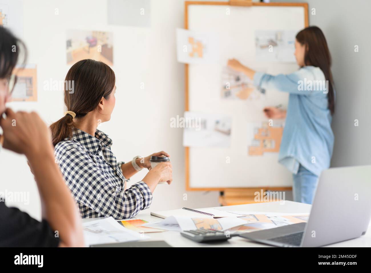 Construction design concept, Female architect is explaining house plan ...