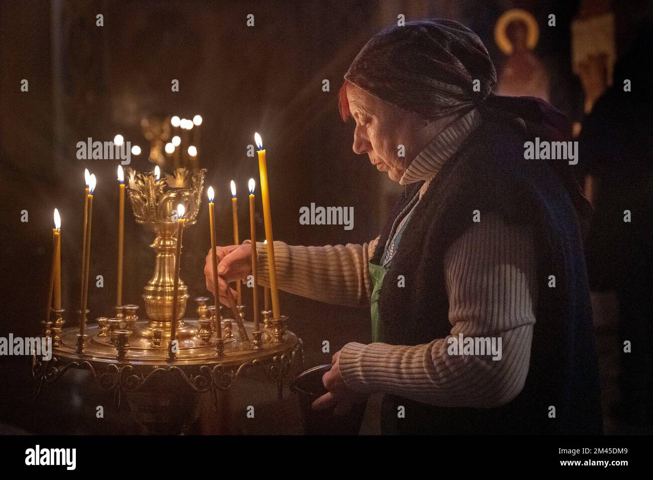 December 18, 2022, Kyiv, Ukraine: A worker at St. Andrew's Church in ...