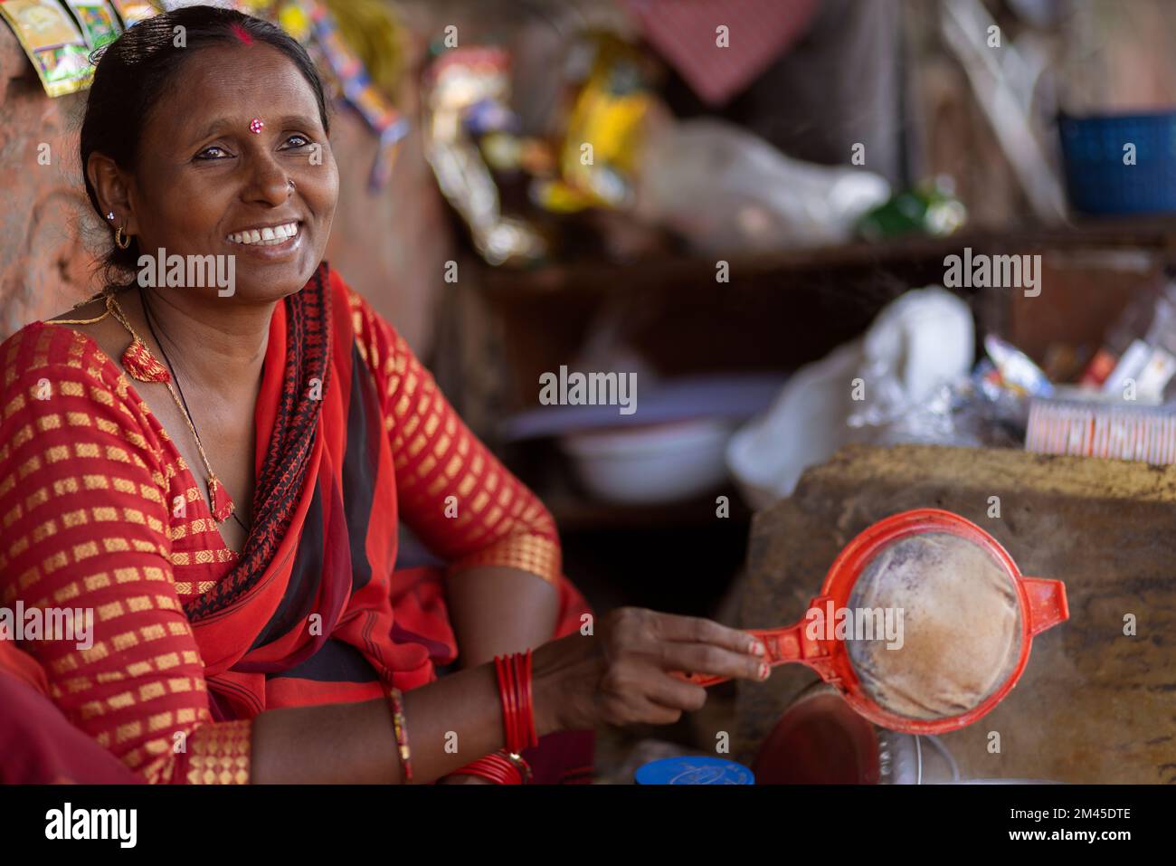 Indian woman making hot tea hi-res stock photography and images - Alamy