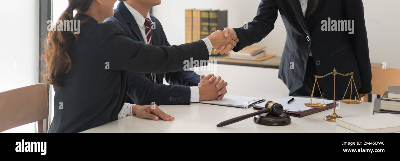 Law concept, Business team shaking hands with female lawyer after deal ...
