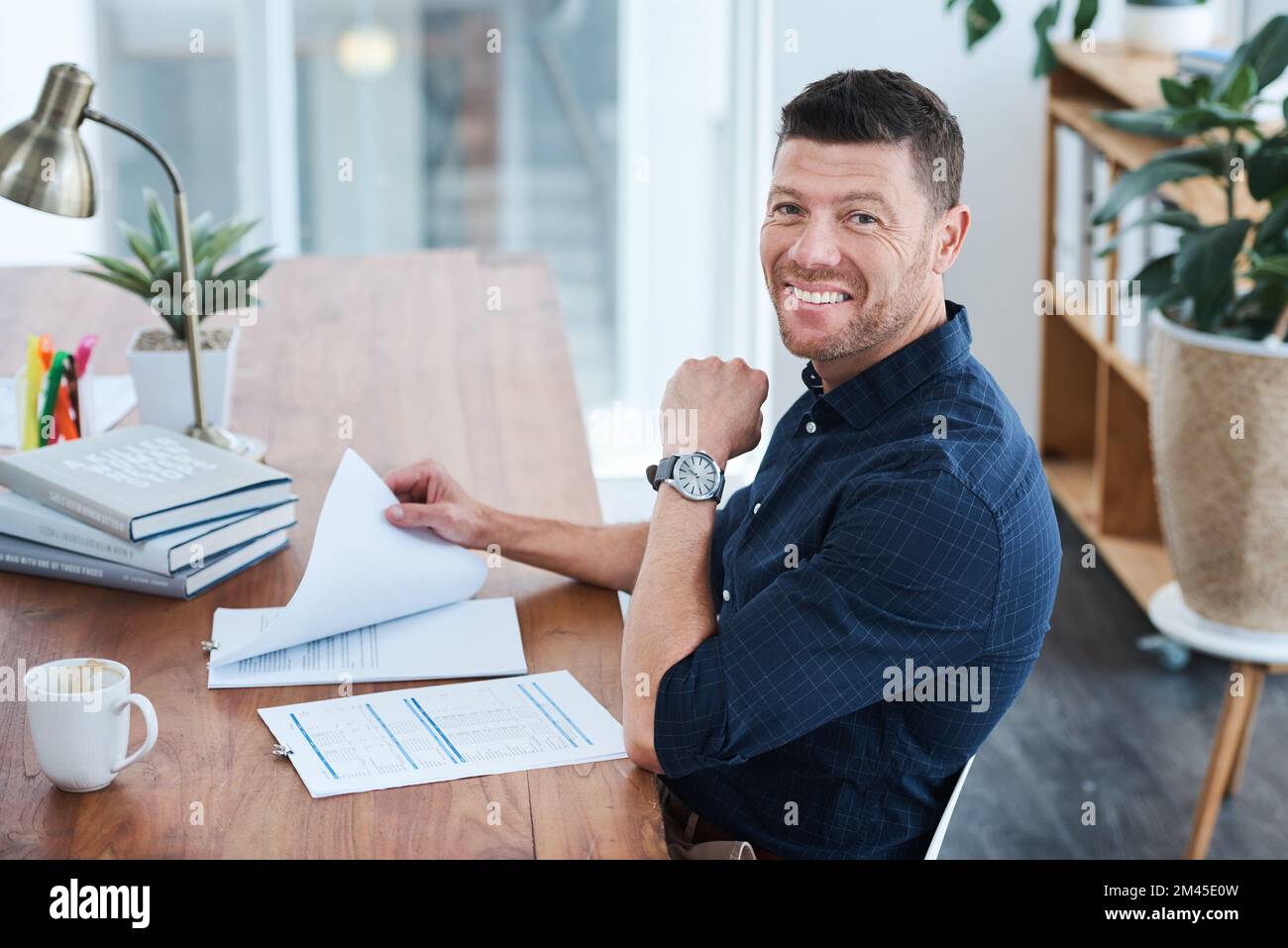 Hes having a great day at the office. a handsome mature businessman ...