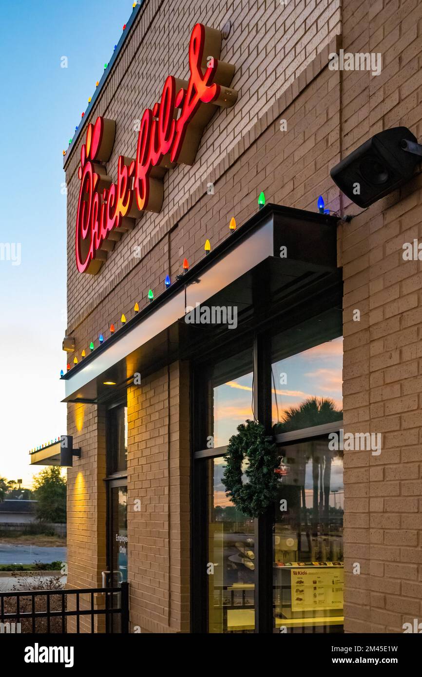 New Chick-fil-A restaurant with Christmas lights and wreath at sunset ...