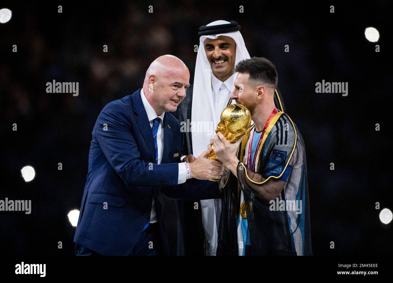 Doha, Qatar. 18th Dec, 2022. Lionel Messi of Argentina carries the FIFA ...