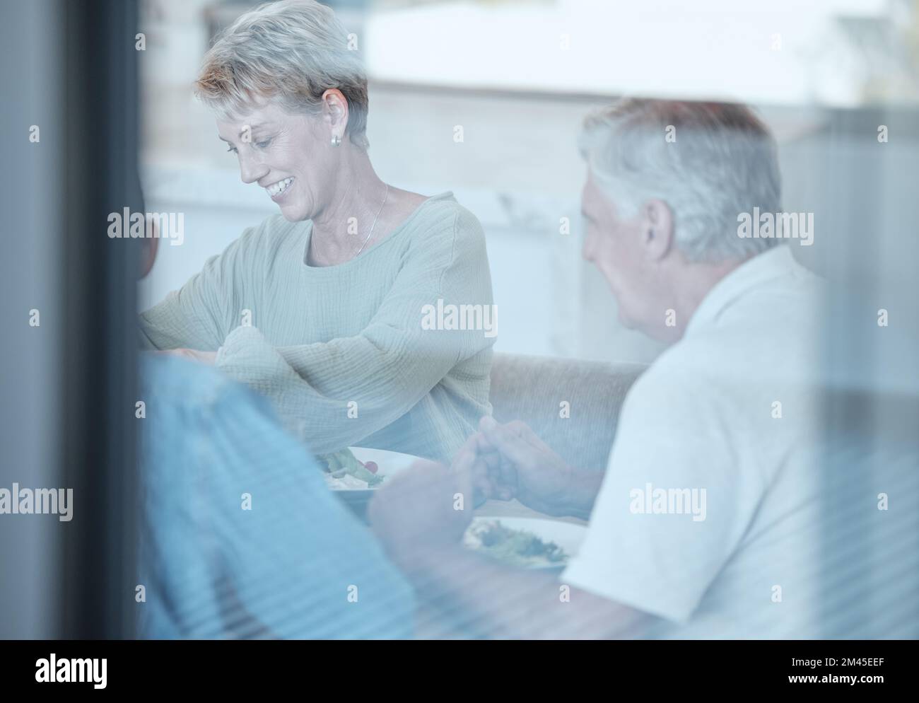 Love, celebration and family with dinner through window enjoy festive ...