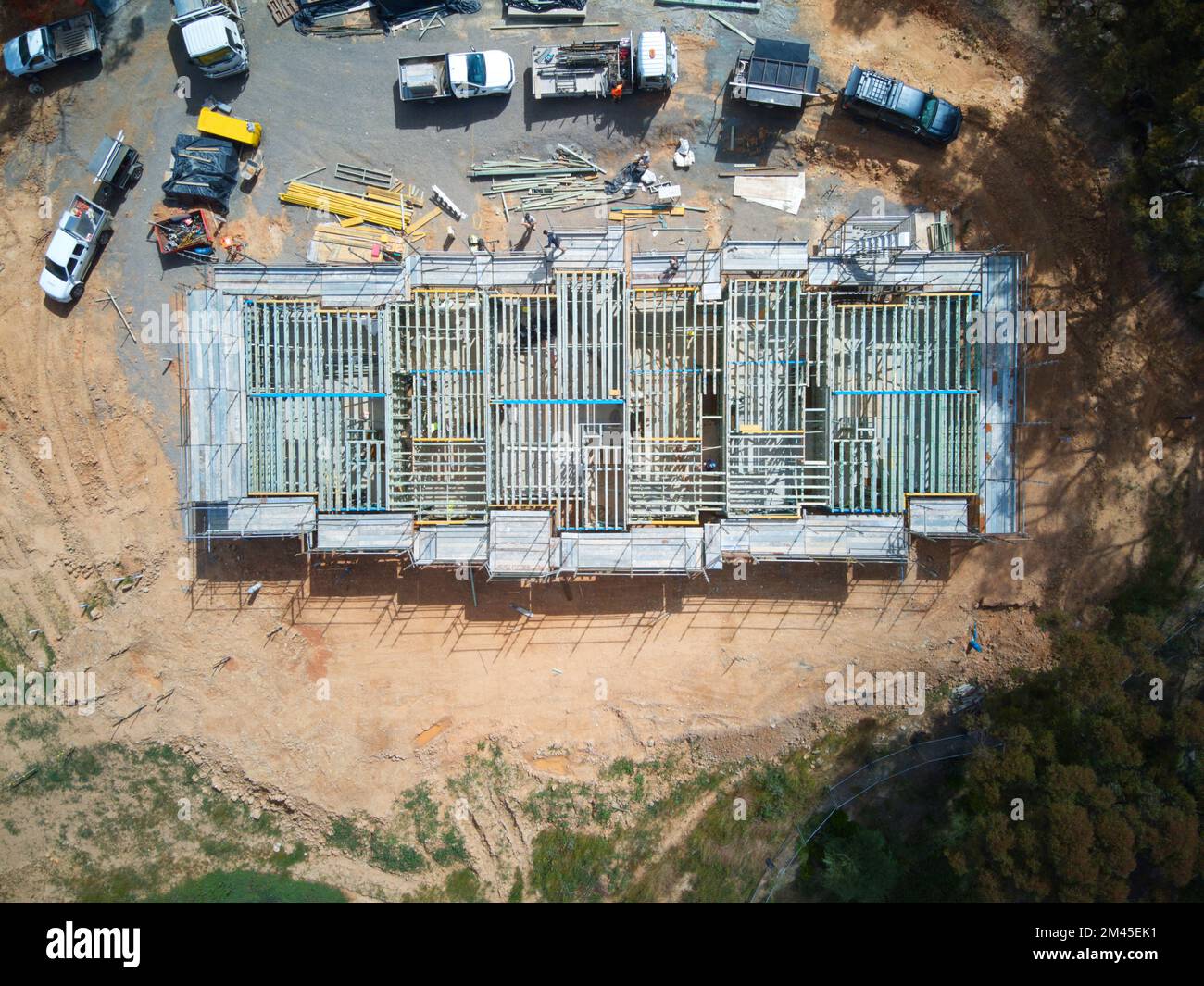 Building construction frame with building site, materials, equipment ...