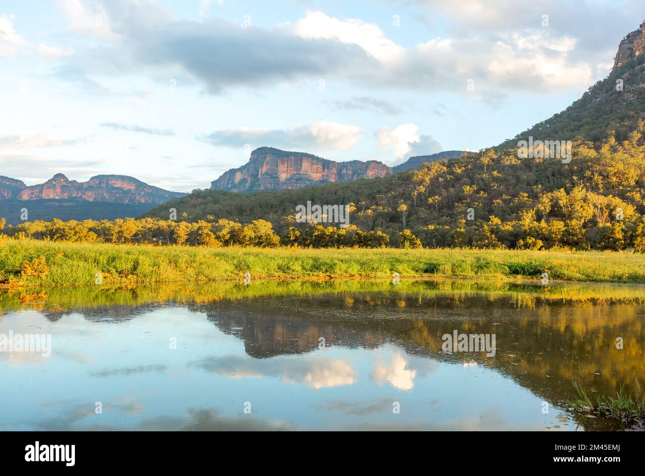 Lush green fields after rain in the Capertee Valley surrounded by ...