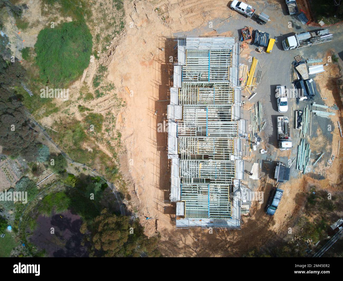 Building construction frame with building site, materials, equipment ...