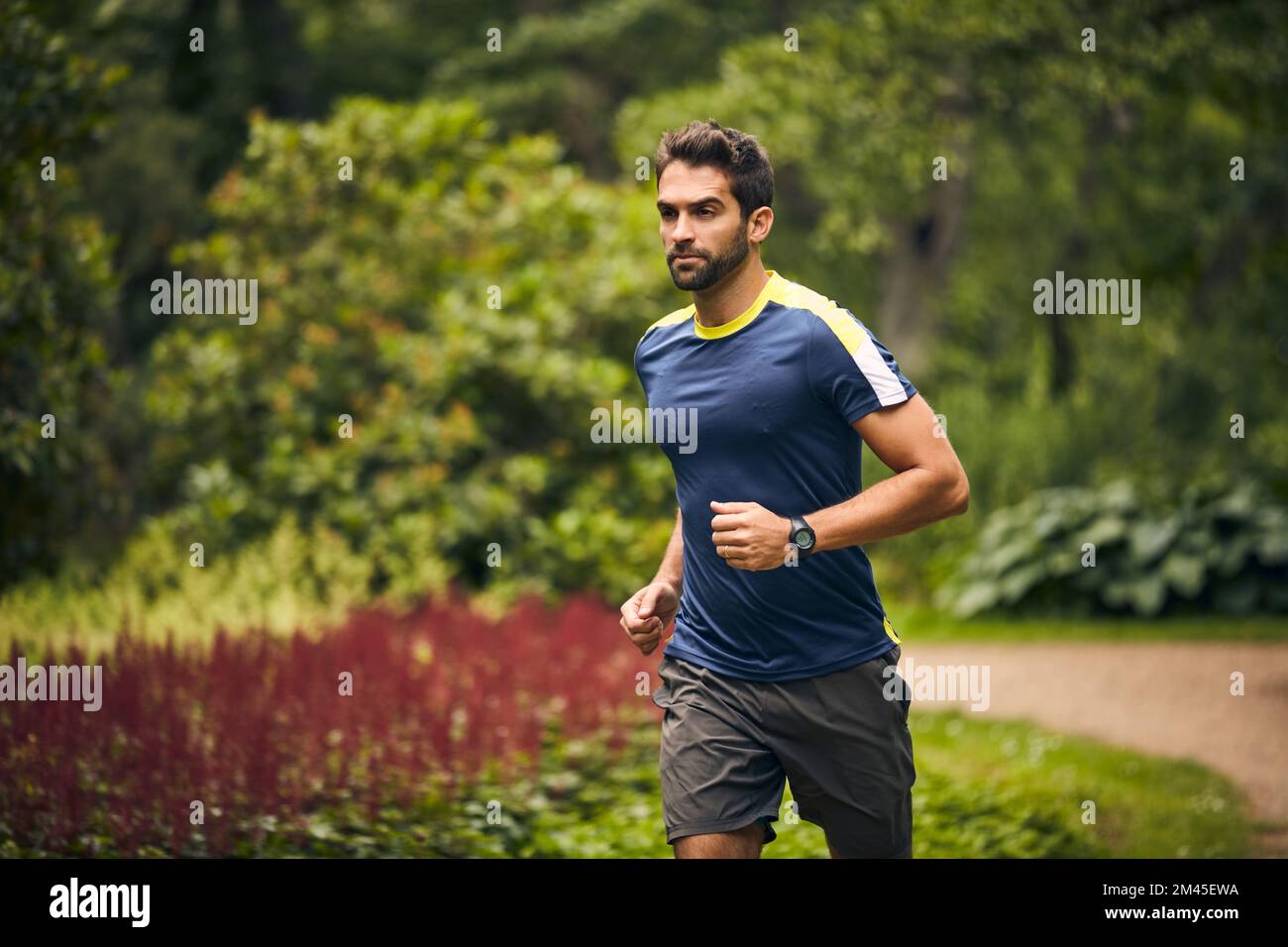 Im running for better health. a sporty middle-aged man out running in a ...