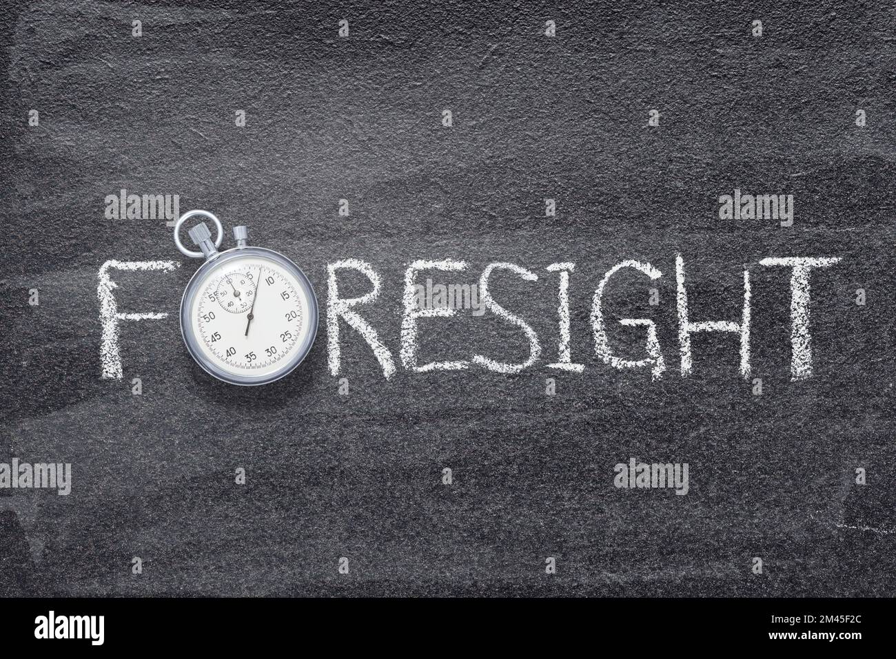 foresight word written on chalkboard with vintage precise stopwatch ...