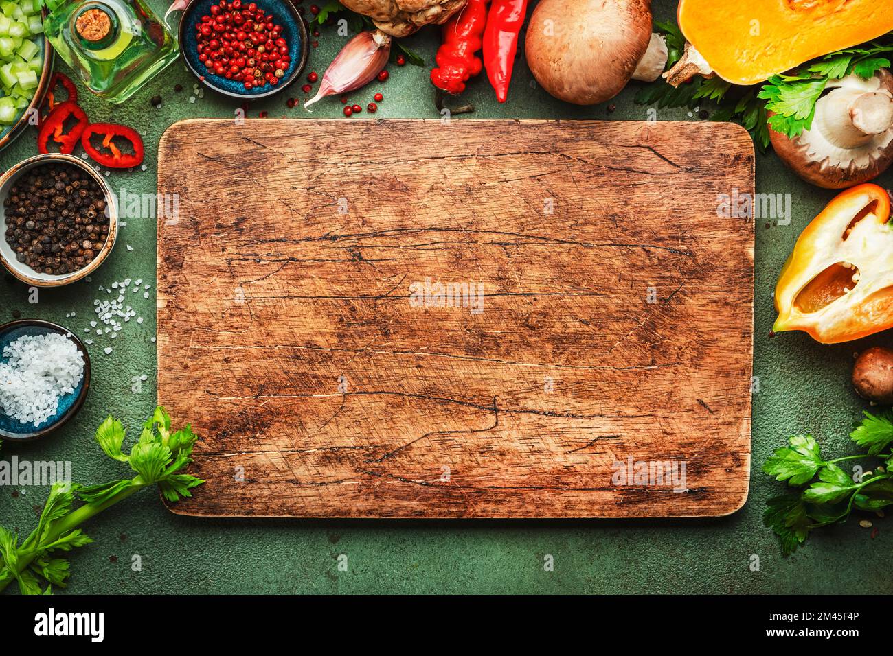 Food background. Rustic wooden cutting board. Vegetables, mushrooms ...
