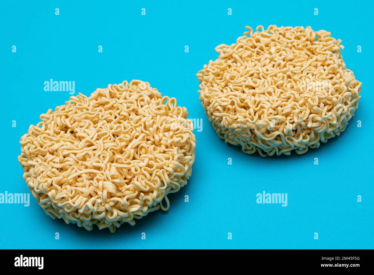 Uncooked Instant Noodles on Blue Background. Raw Pasta. Dry Asian Fast ...