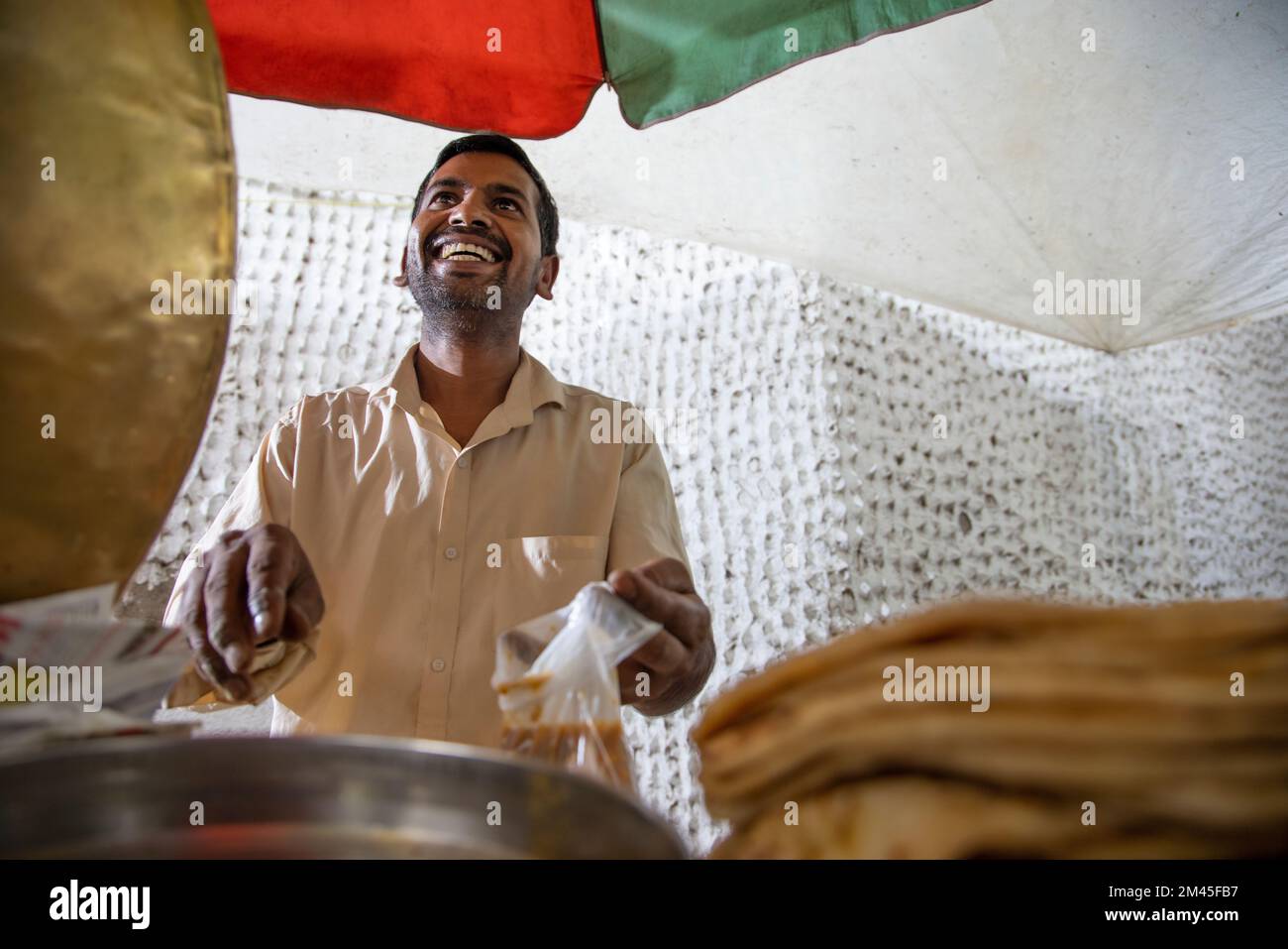 Male vendor selling paratha at his roadside food stall Stock Photo - Alamy