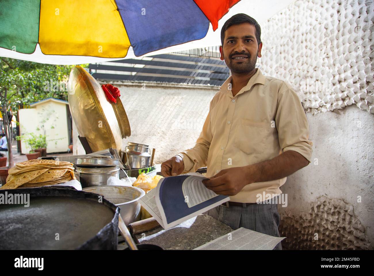 Male vendor selling paratha at his roadside food stall Stock Photo - Alamy