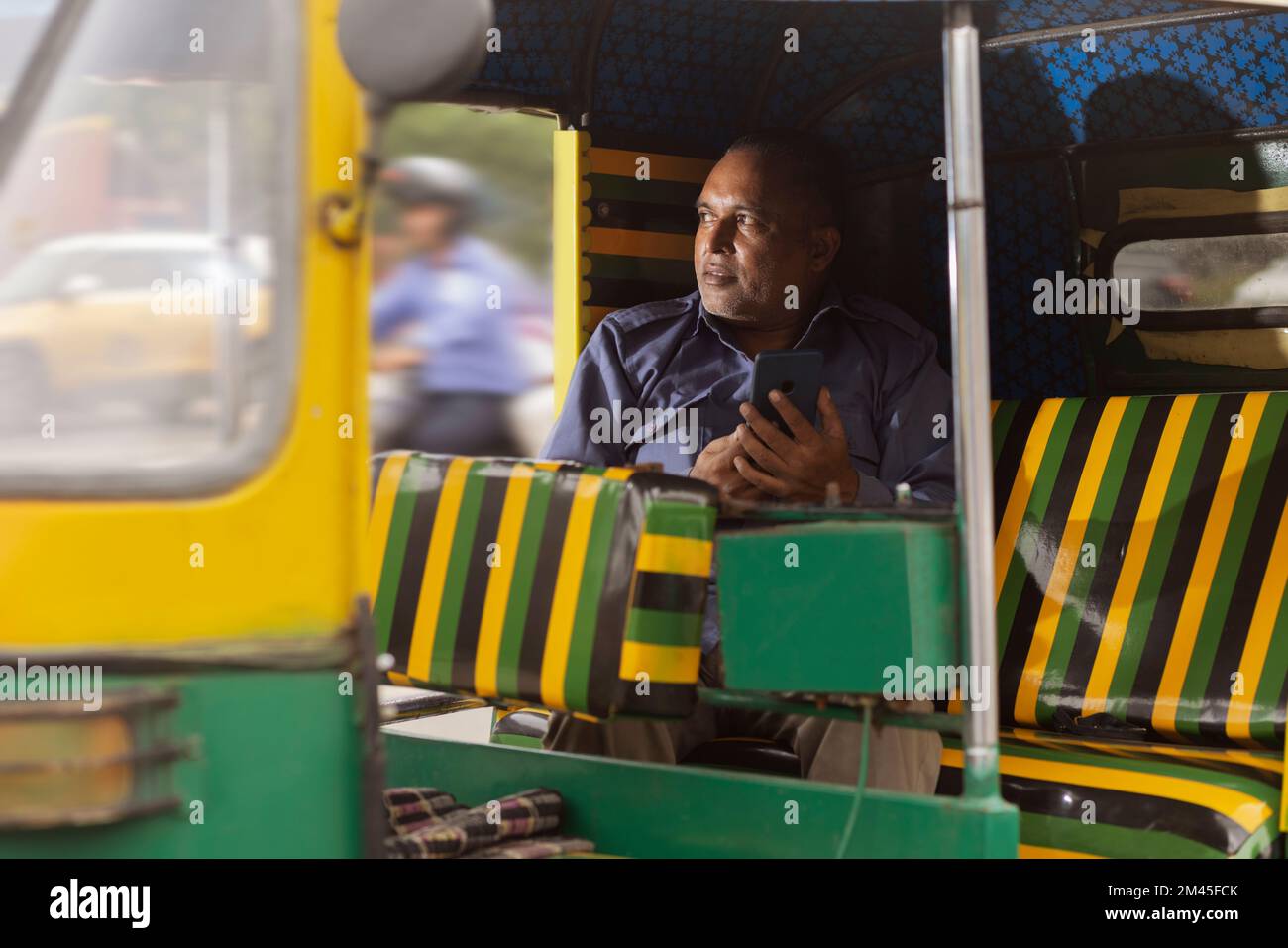 Auto rickshaw using mobile hi-res stock photography and images - Alamy