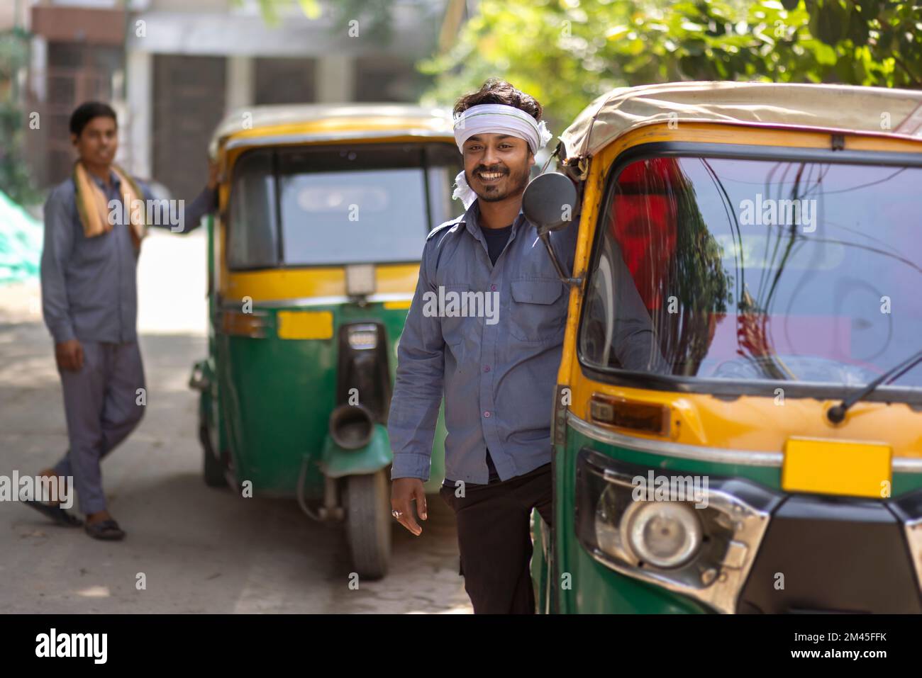 Portrait of auto rickshaw drivers standing at auto stand Stock Photo ...